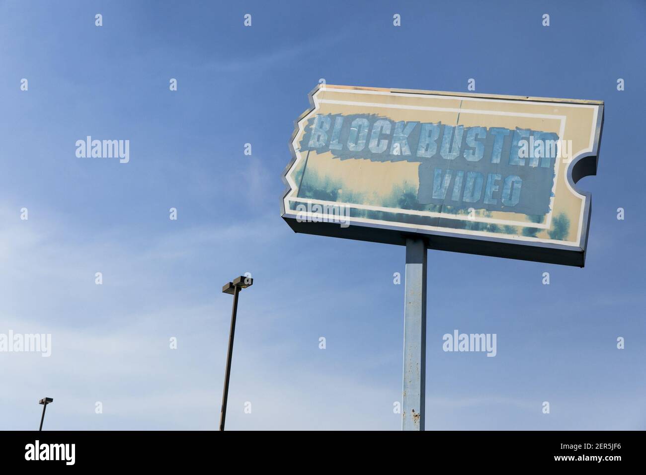A painted over logo sign of a long closed Blockbuster Video store in ...