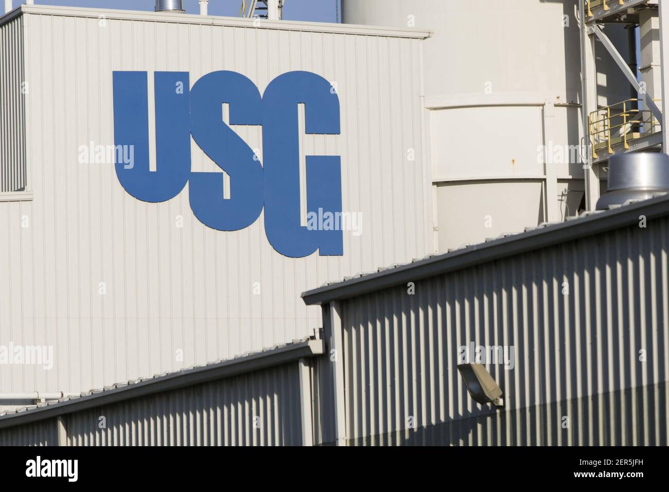 A logo sign outside of a facility occupied by the USG Corporation, also ...
