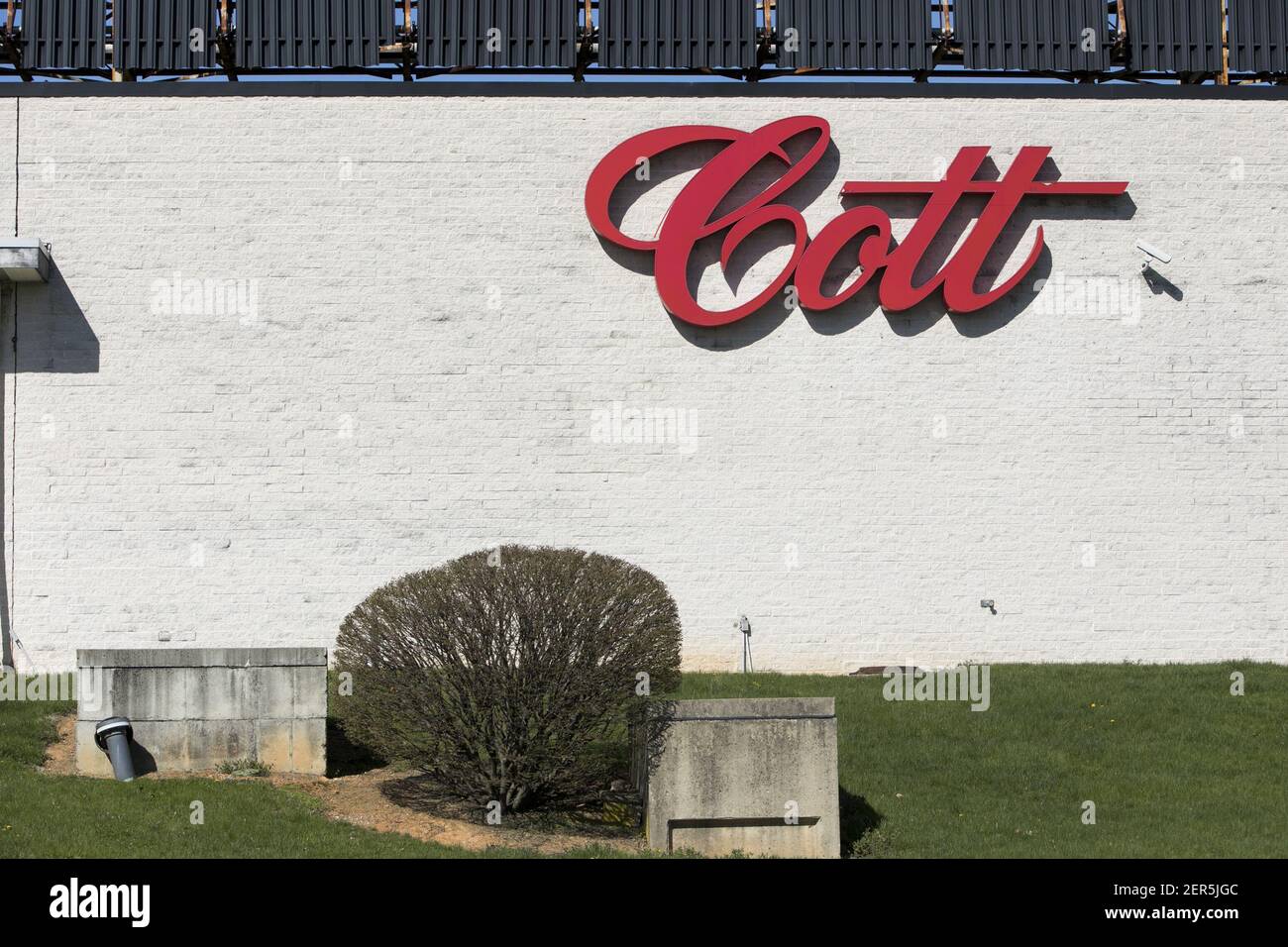 A logo sign outside of a facility occupied by the Cott Corporation in ...