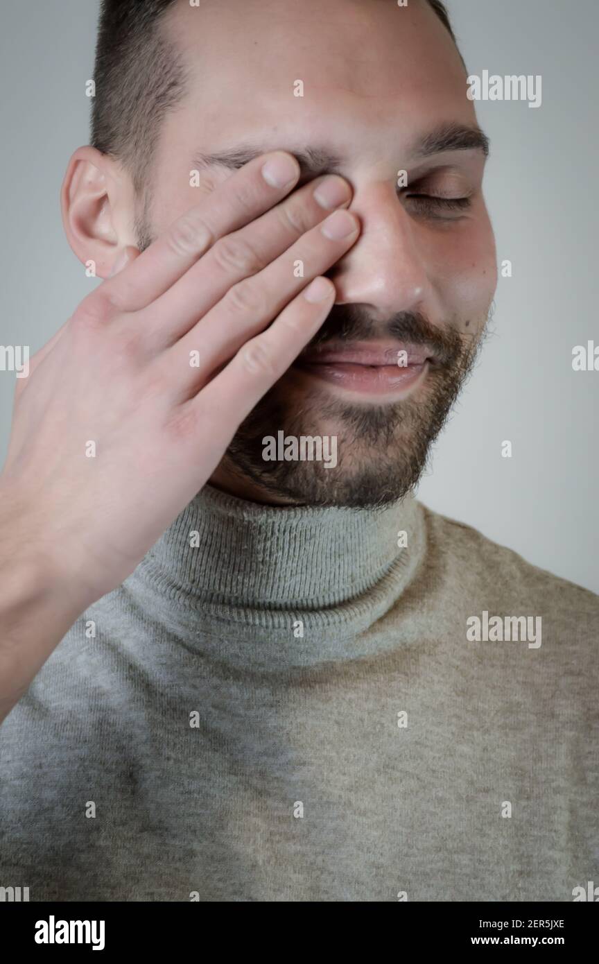 Hand covering eye hi-res stock photography and images - Alamy