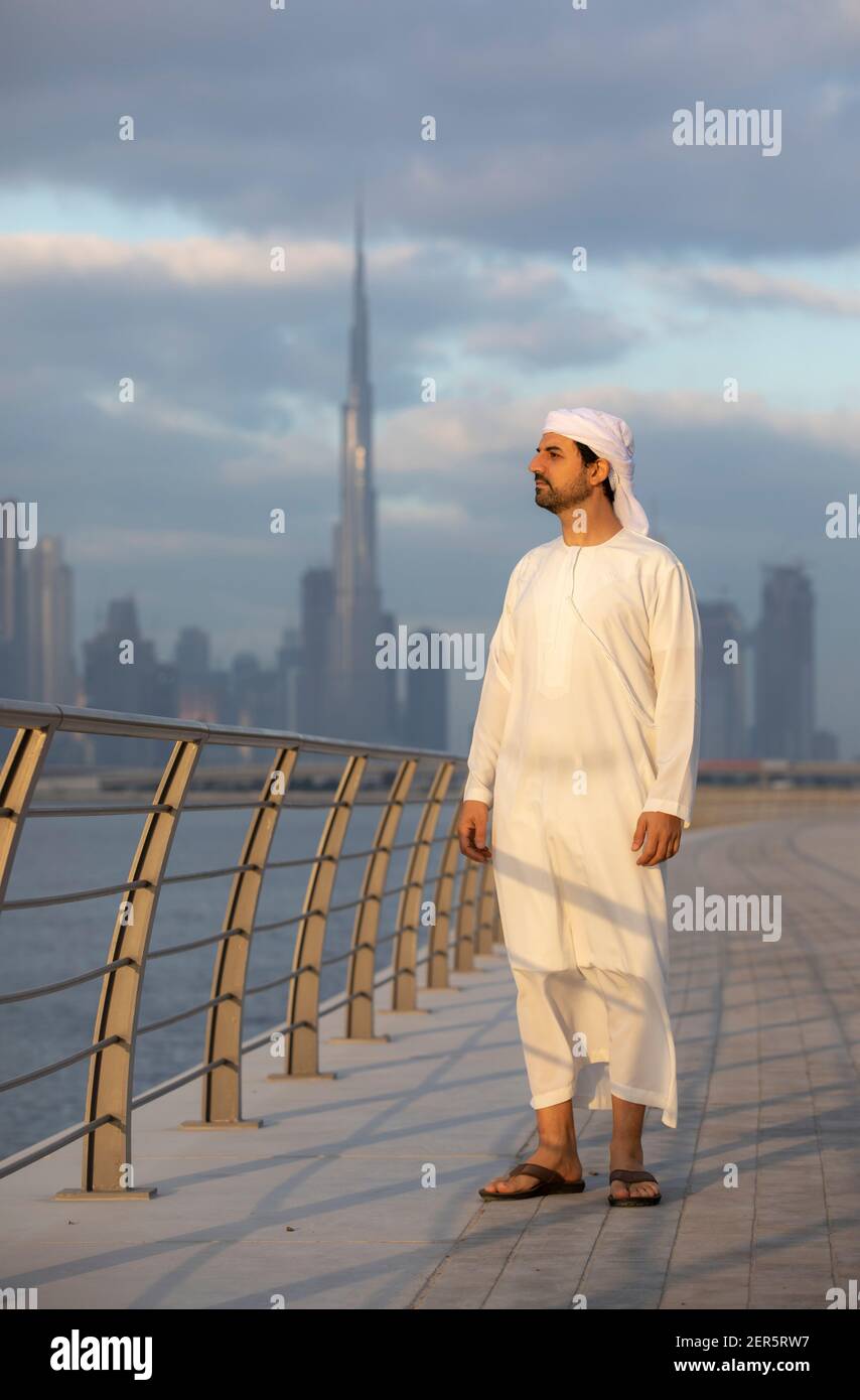 emirati Man at Al Jaddaf waterfront in Dubai with Burj Khalifa at the ...