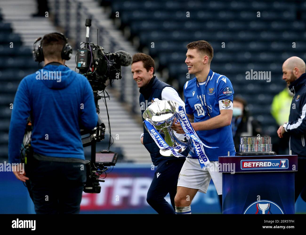 St Johnstone captain Jason Kerr collects the Betfred Cup trophy after ...