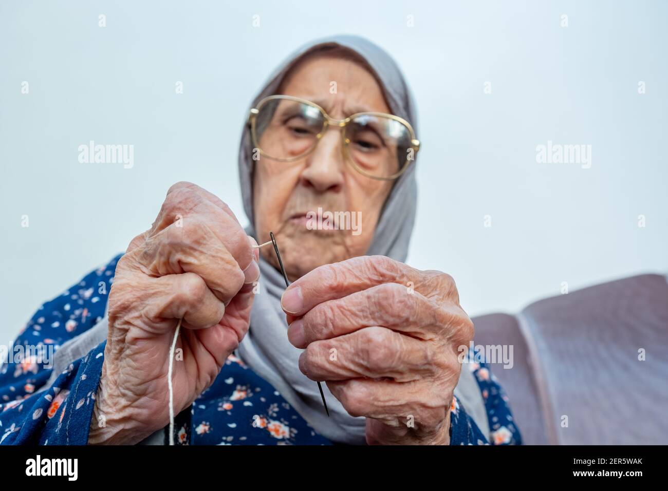 Elderly woman in needle crafts hi-res stock photography and images - Alamy