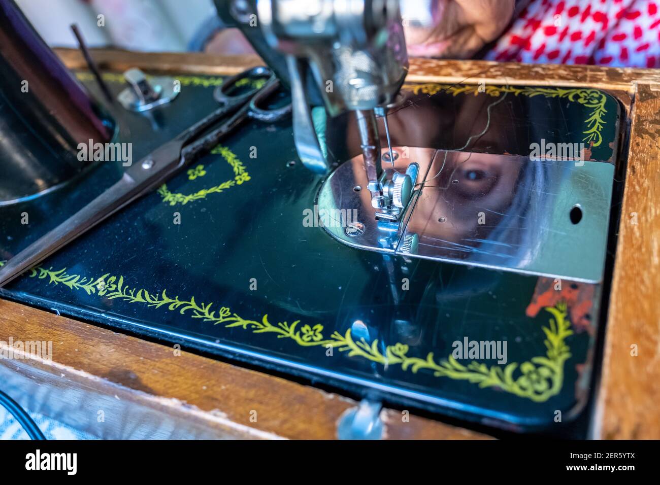 Arabic muslim old woman face reflection in sewing machine Stock Photo ...
