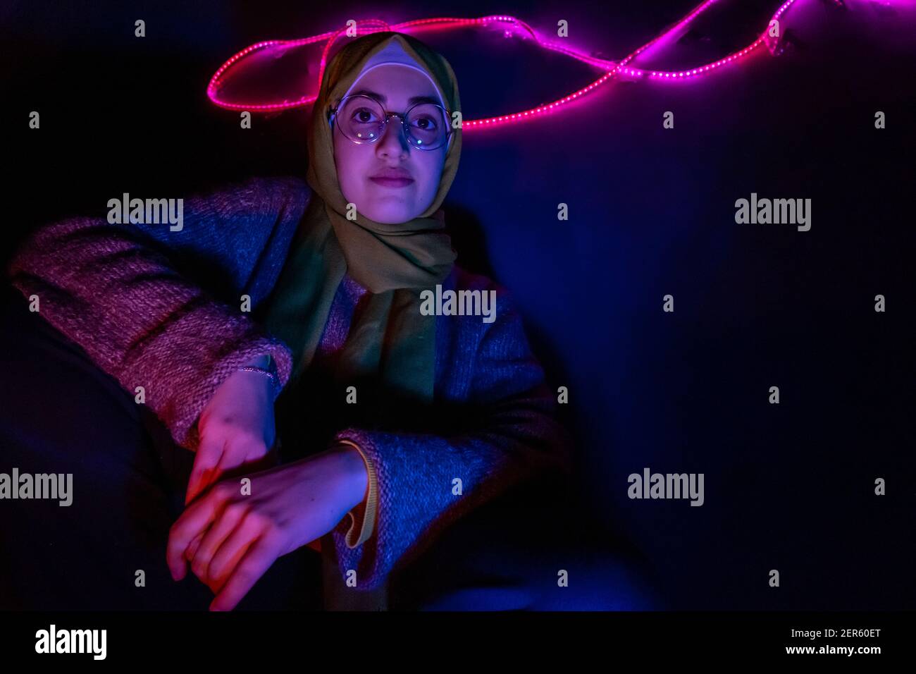 Arabic muslim girl with beatiful colored lights behind her Stock Photo ...