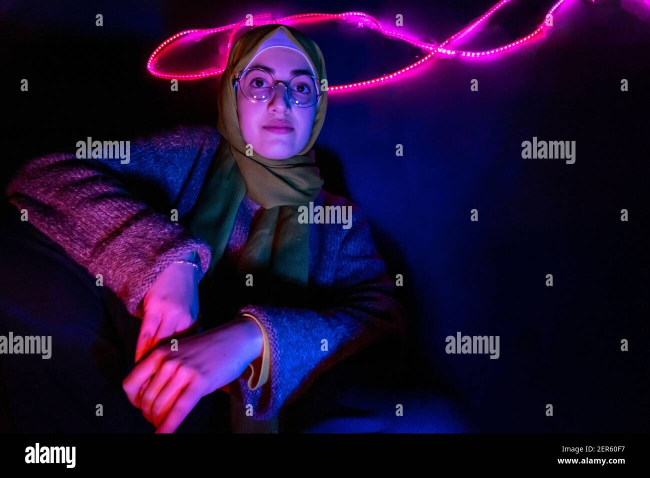 Arabic muslim girl with beatiful colored lights behind her Stock Photo ...
