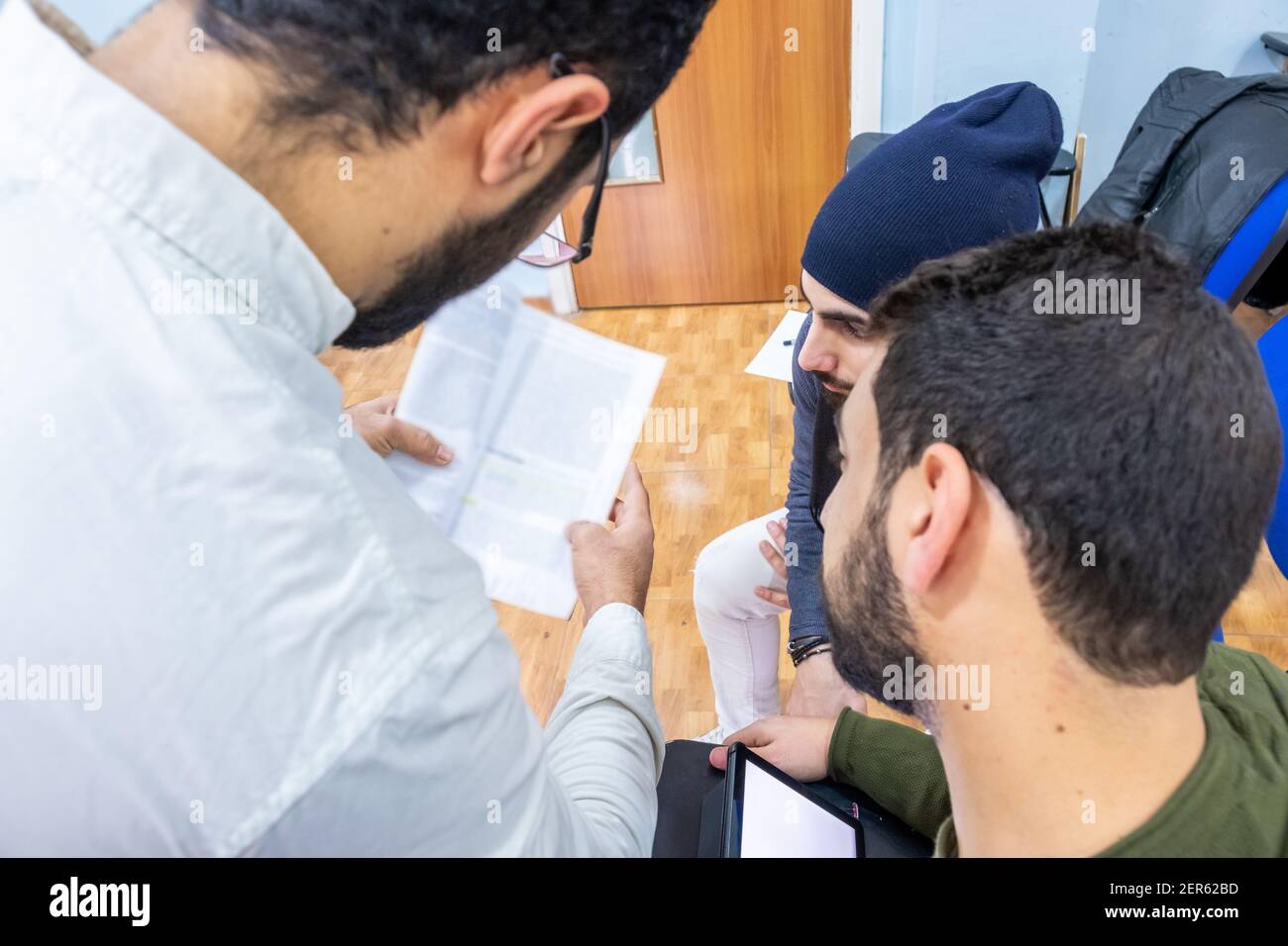 Arabic students discussing things in class Stock Photo - Alamy