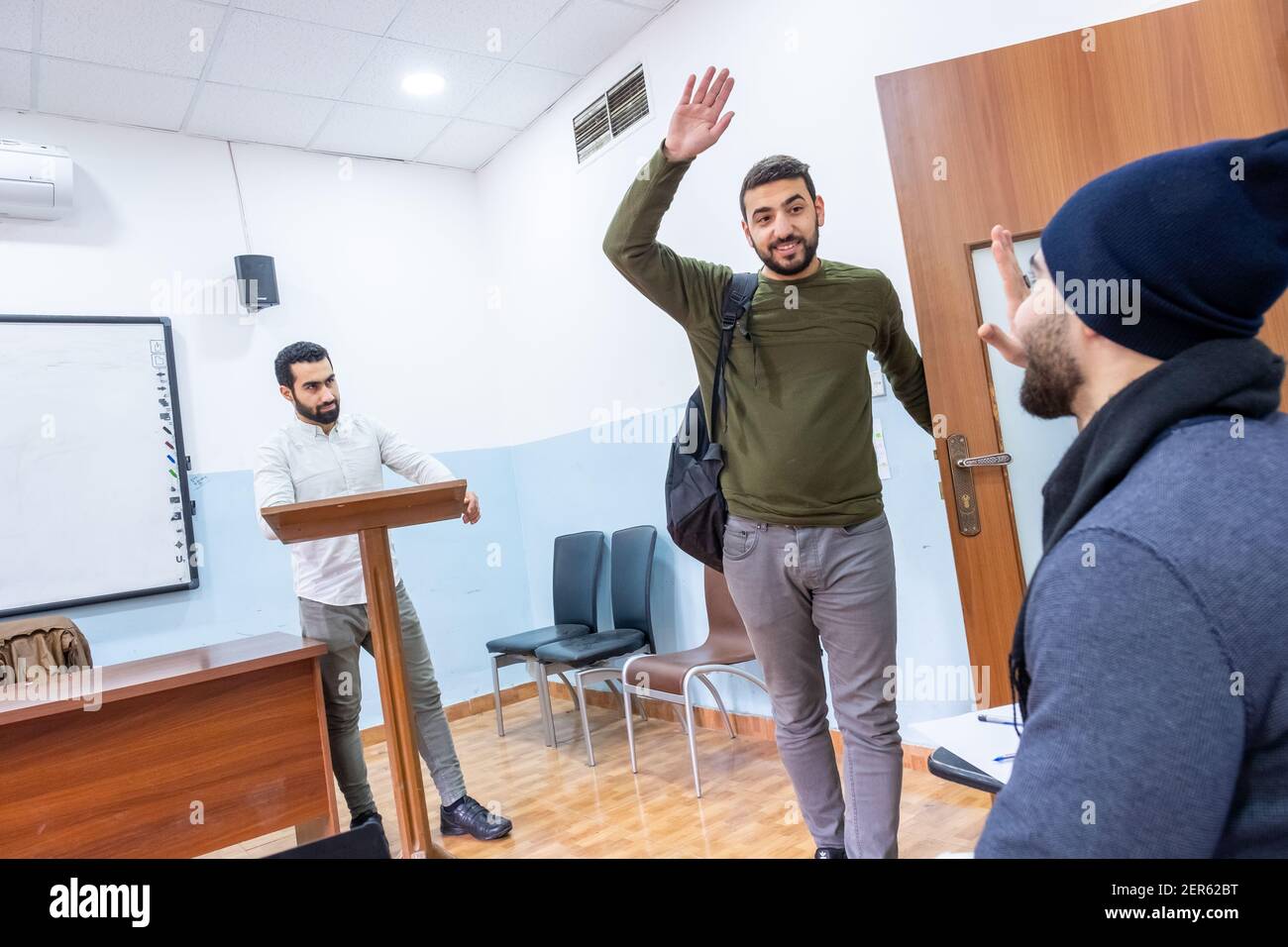 Arabic student coming late to class Stock Photo - Alamy