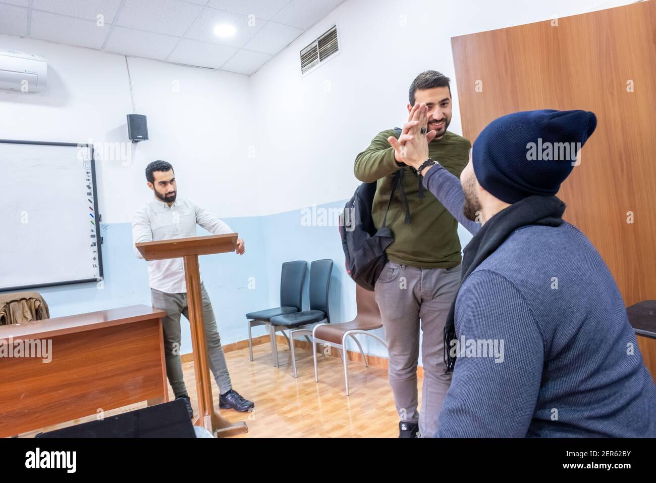 Arabic student coming late to class Stock Photo - Alamy