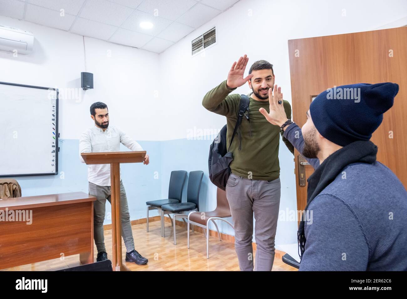 Arabic student coming late to class Stock Photo - Alamy
