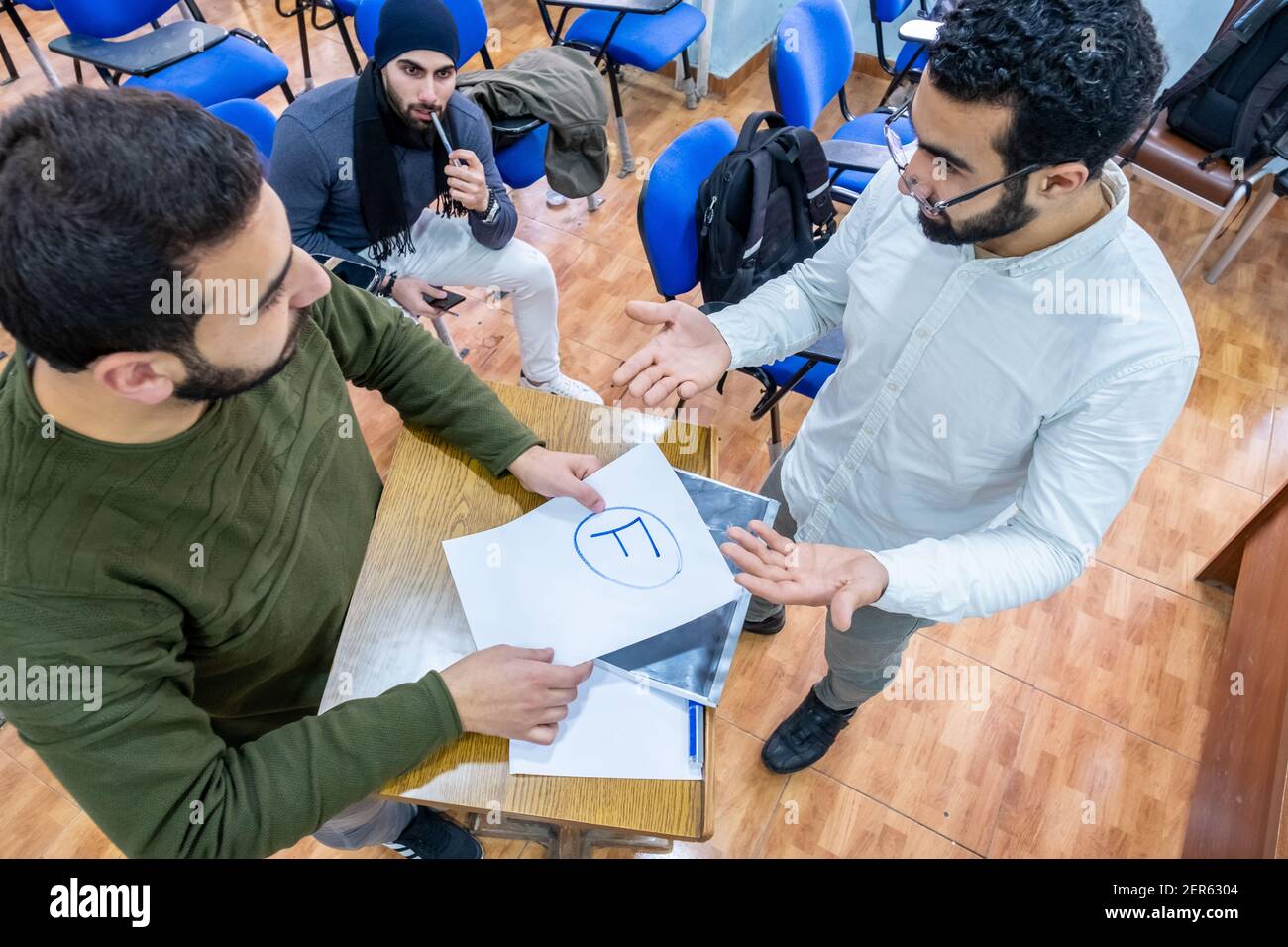 Arabic student getting his exam results Stock Photo - Alamy