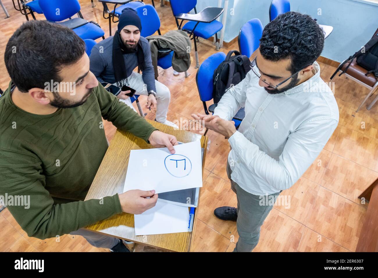 Arabic student getting his exam results Stock Photo - Alamy