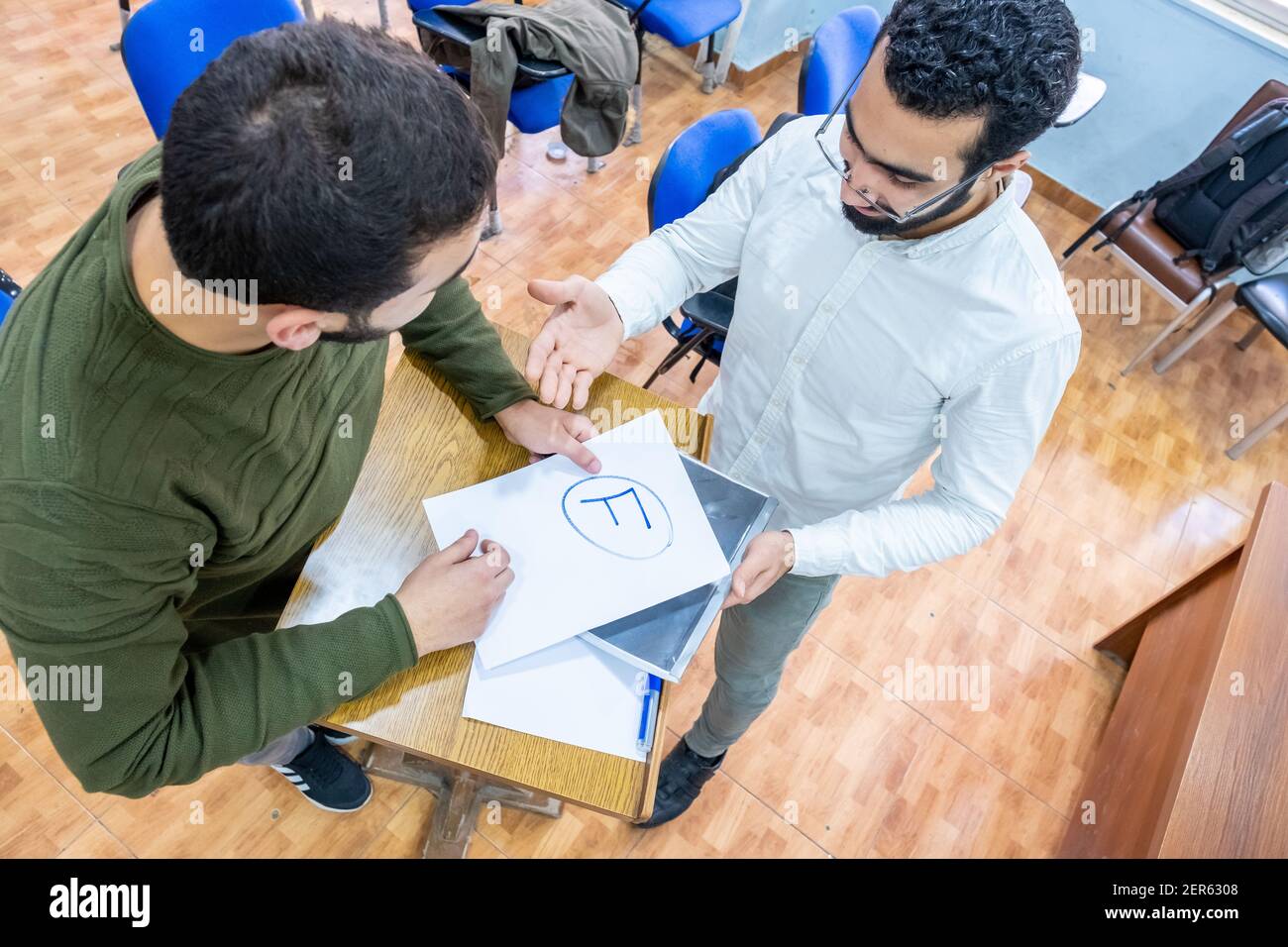 Arabic student getting his exam results Stock Photo - Alamy