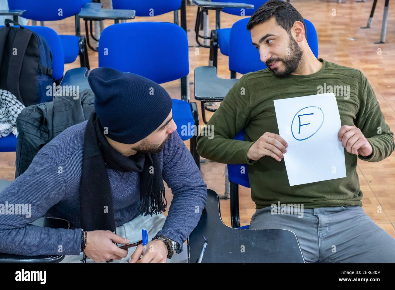 Arabic student getting his exam results Stock Photo - Alamy