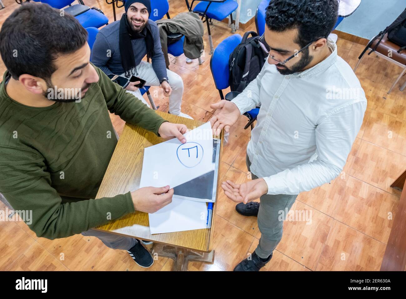 Arabic student getting his exam results Stock Photo - Alamy