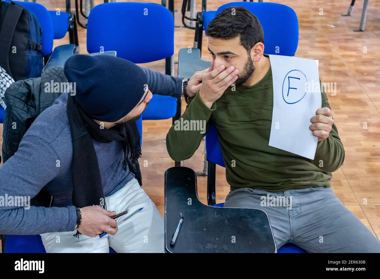Arabic student getting his exam results Stock Photo - Alamy