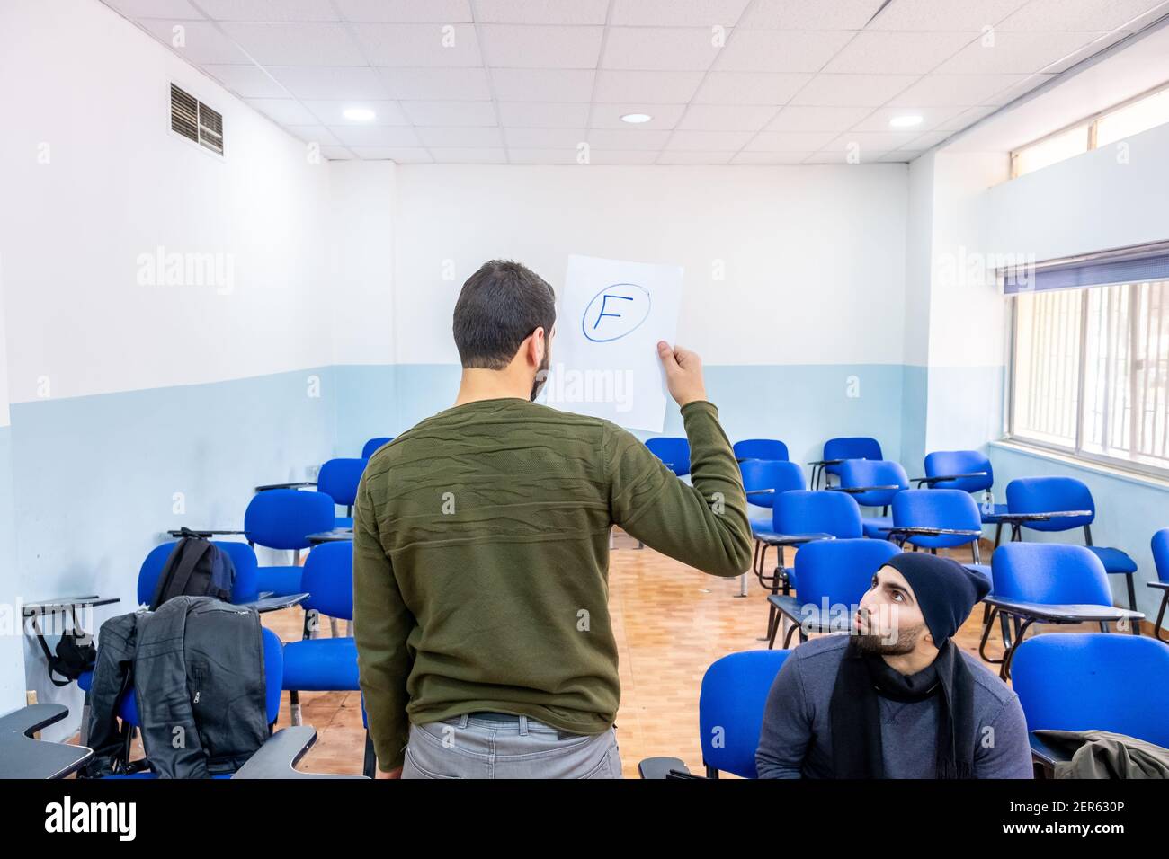 Arabic student getting his exam results Stock Photo - Alamy