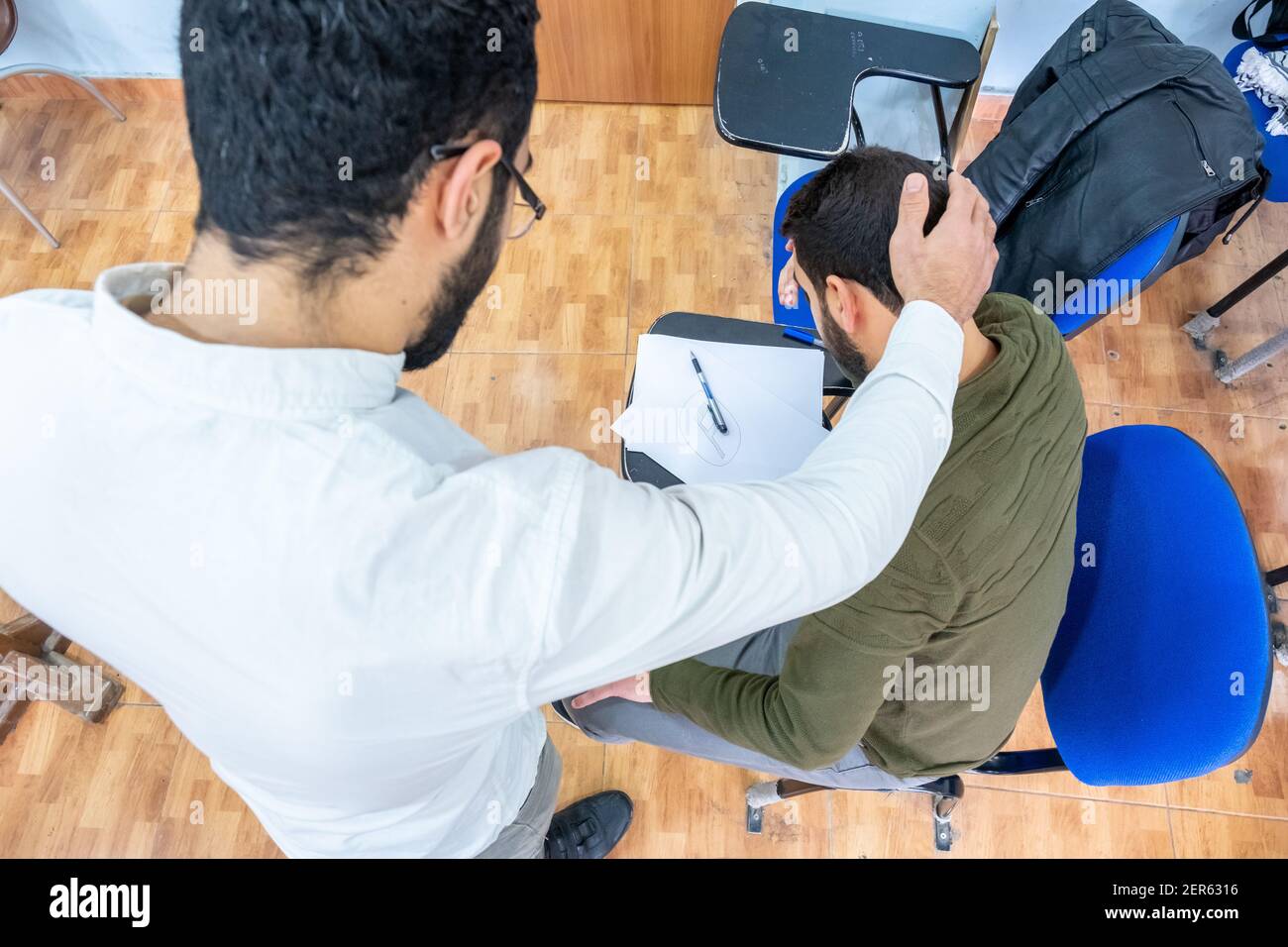 Arabic students discussing things in class Stock Photo - Alamy