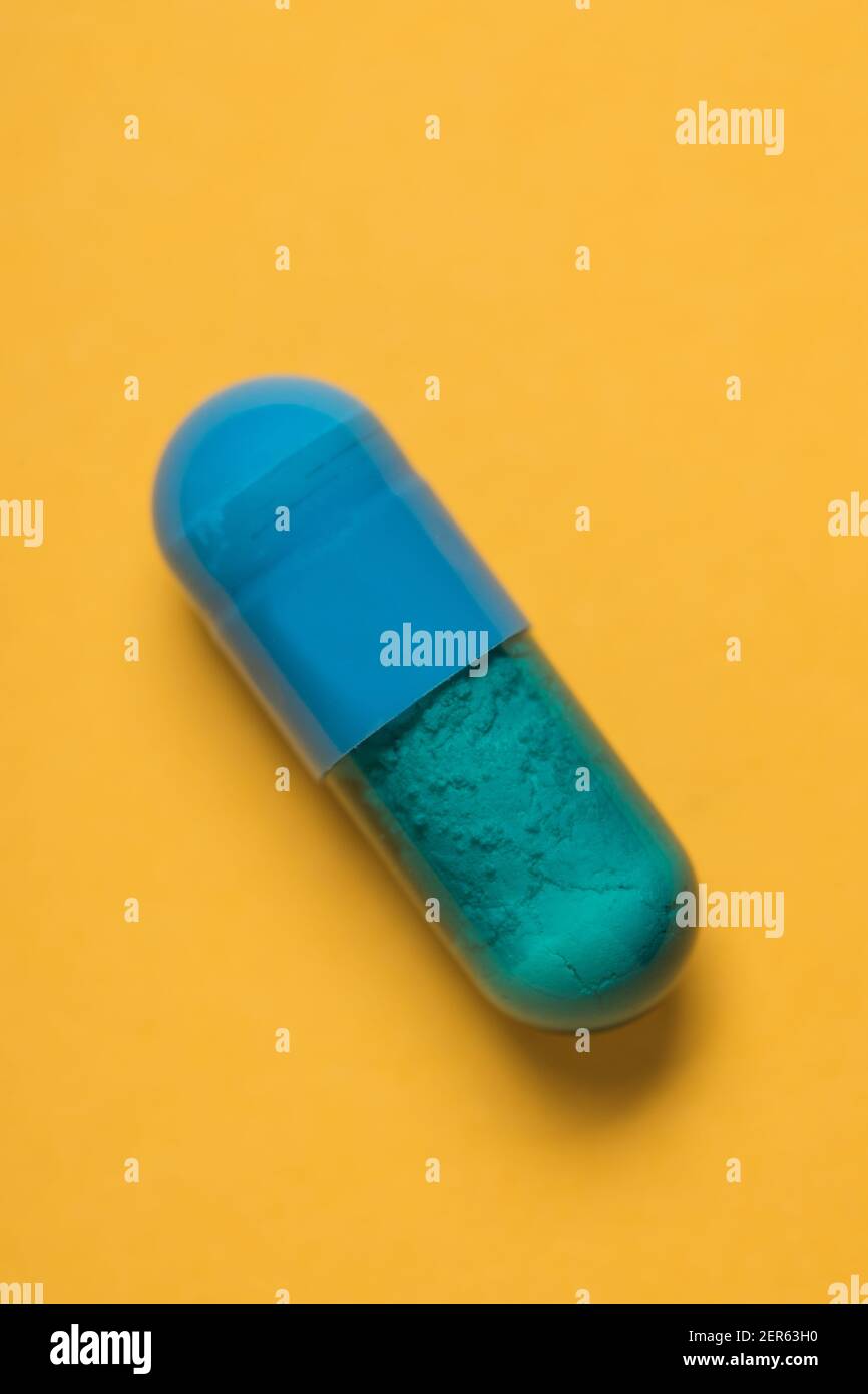High angle of blue capsule of pharmaceutical medicinal product placed ...