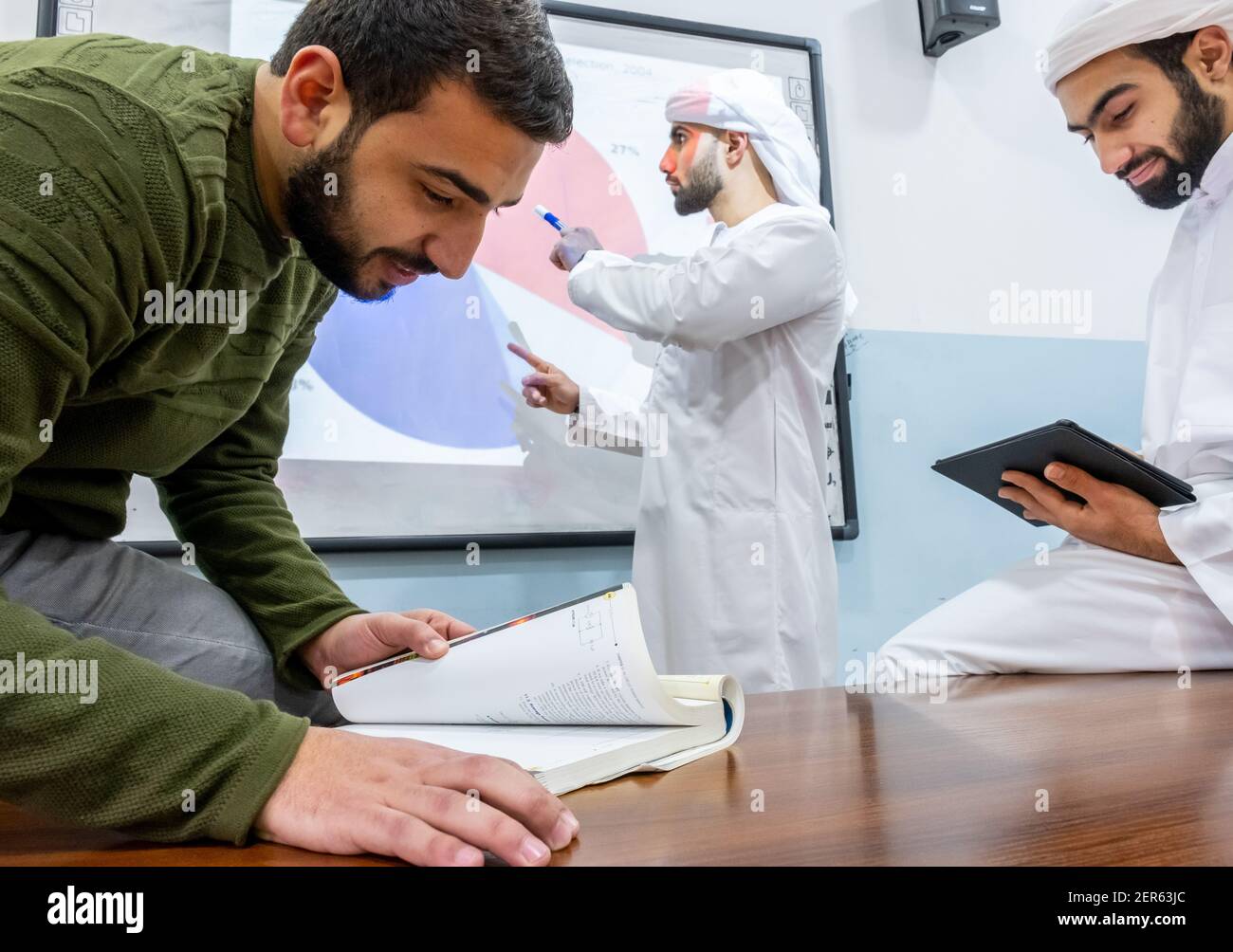Group of arabic friends preparing presentation togther Stock Photo - Alamy