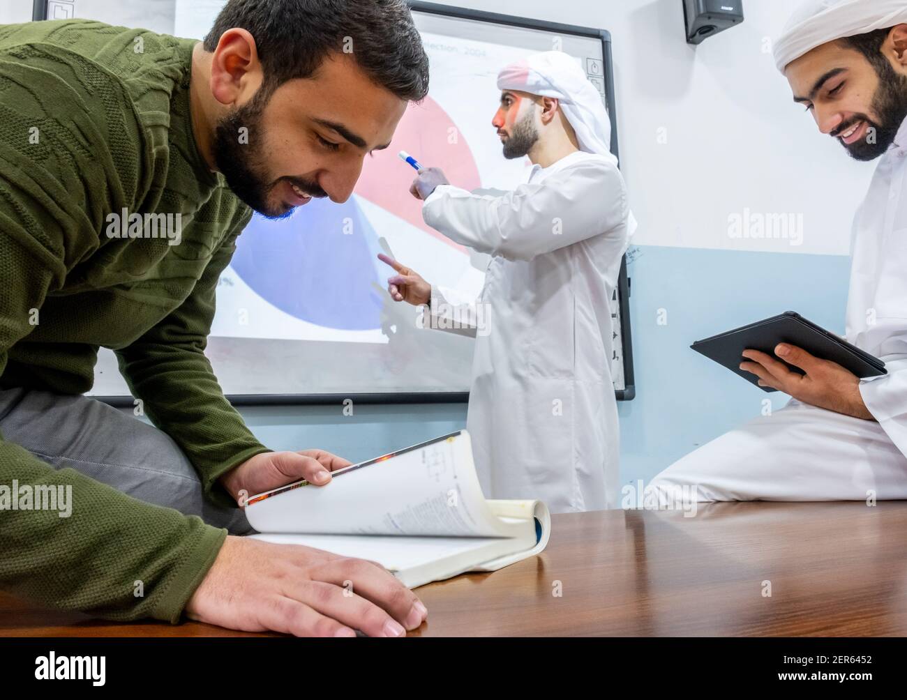 Group of arabic friends preparing presentation togther Stock Photo - Alamy
