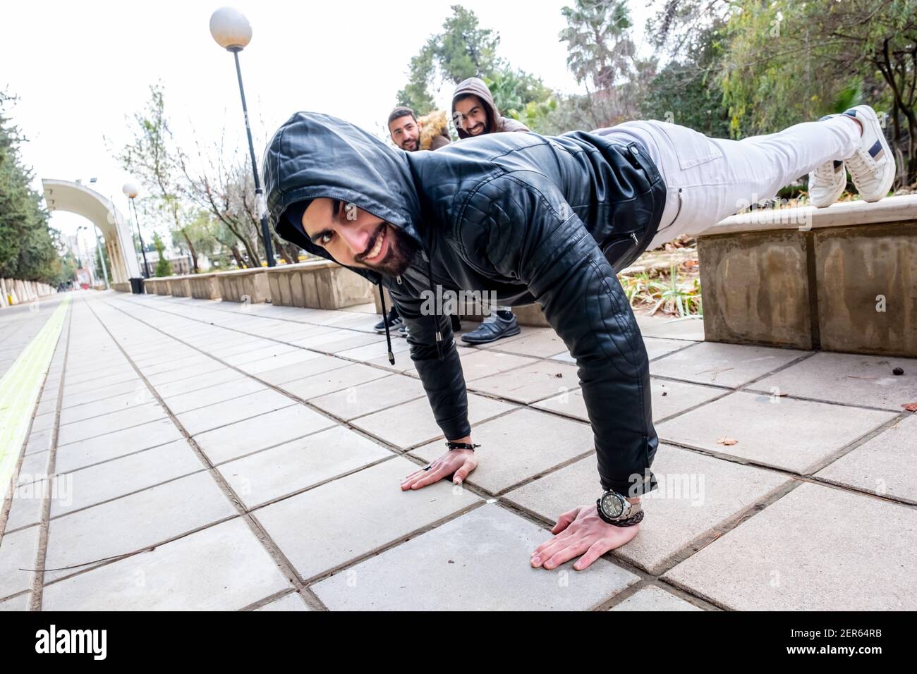 Arabic muslim guy doing pushups at campus Stock Photo - Alamy