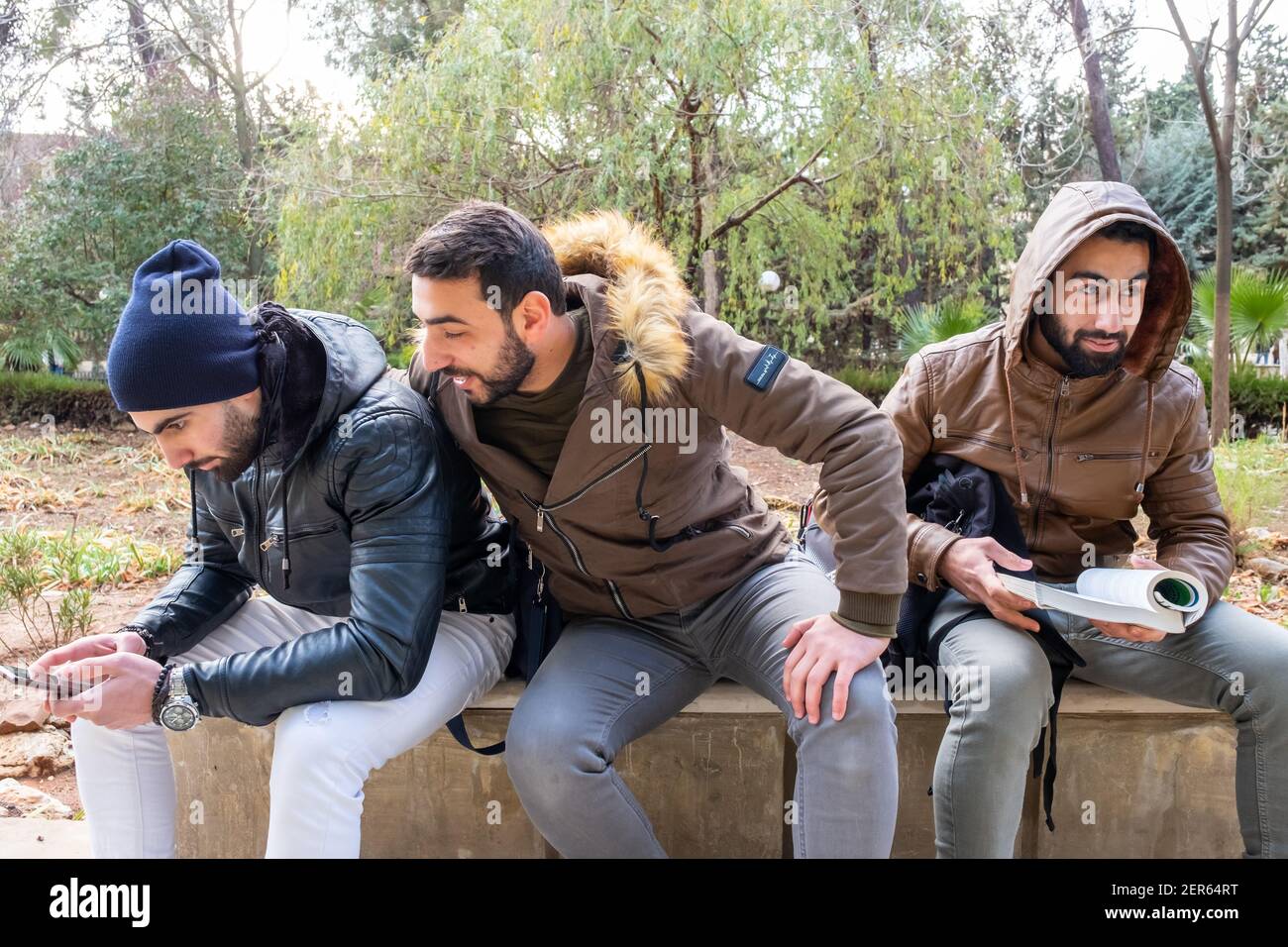 Arabic muslim friends at university studying togther Stock Photo - Alamy
