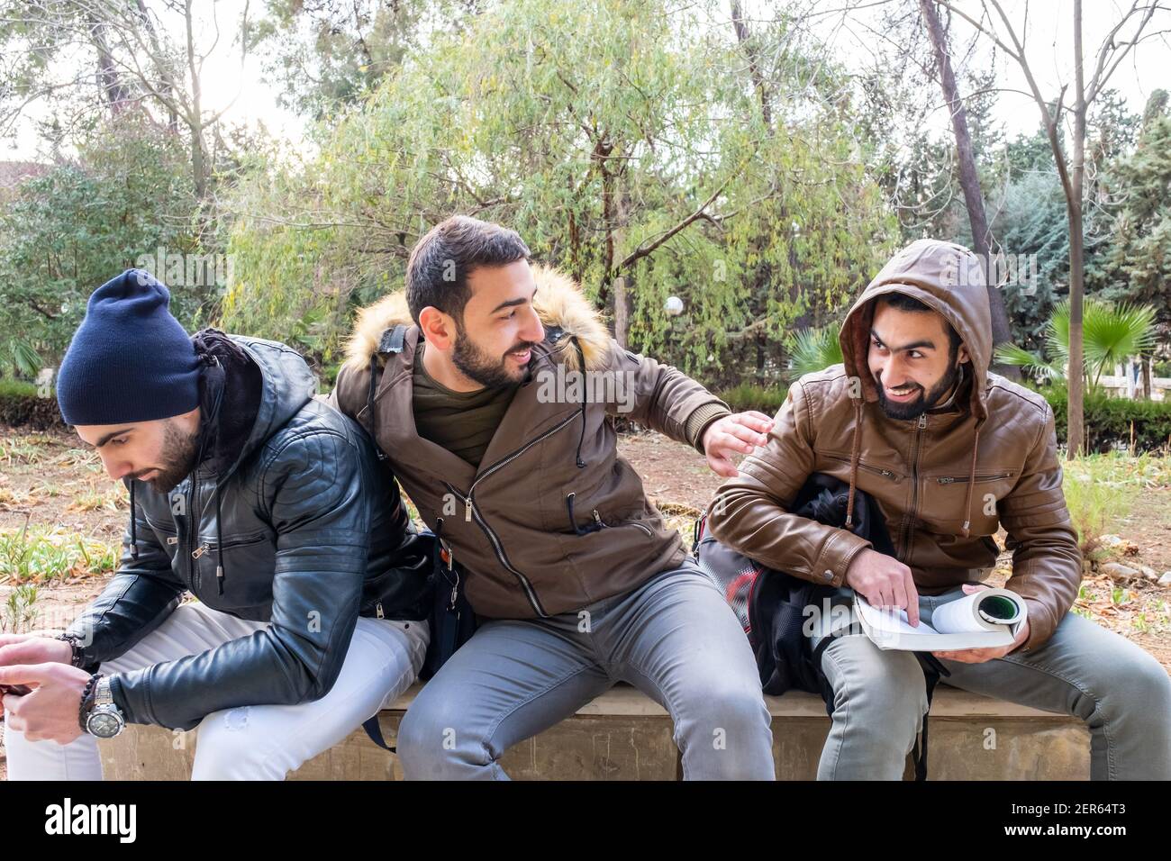 Arabic muslim friends at university studying togther Stock Photo - Alamy