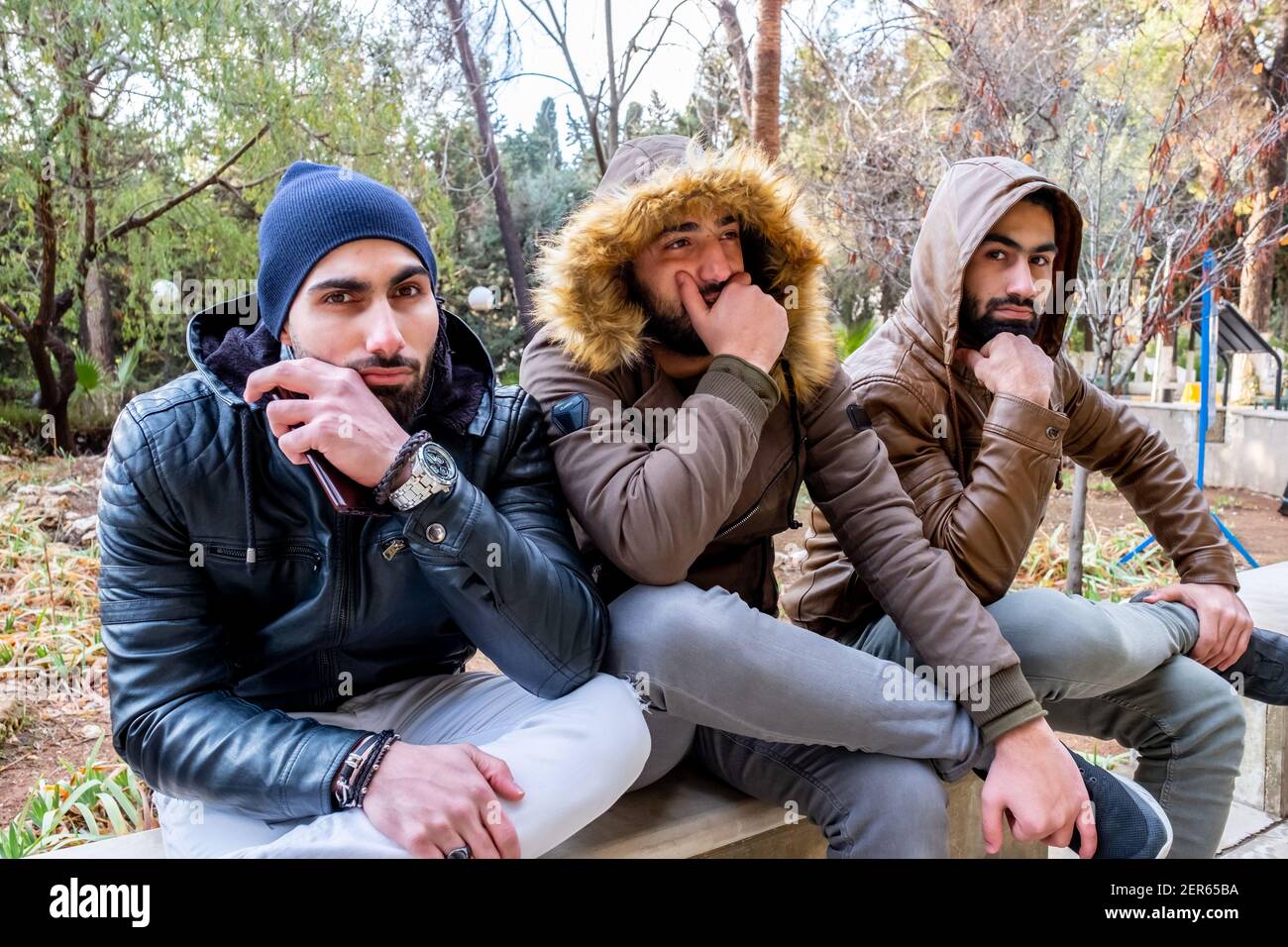 Msulim arabic friends sitting on bench and wondering about some stuff ...