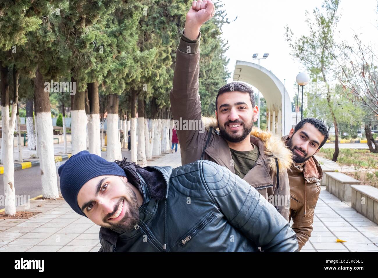 Happy arabic friends enjoying their time at university Stock Photo - Alamy