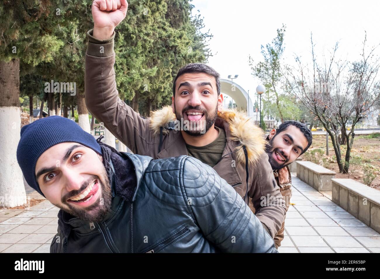 Happy arabic friends enjoying their time at university Stock Photo - Alamy
