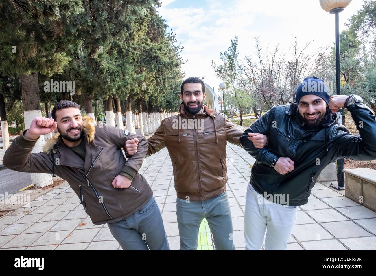 Happy arabic friends enjoying their time at university Stock Photo - Alamy