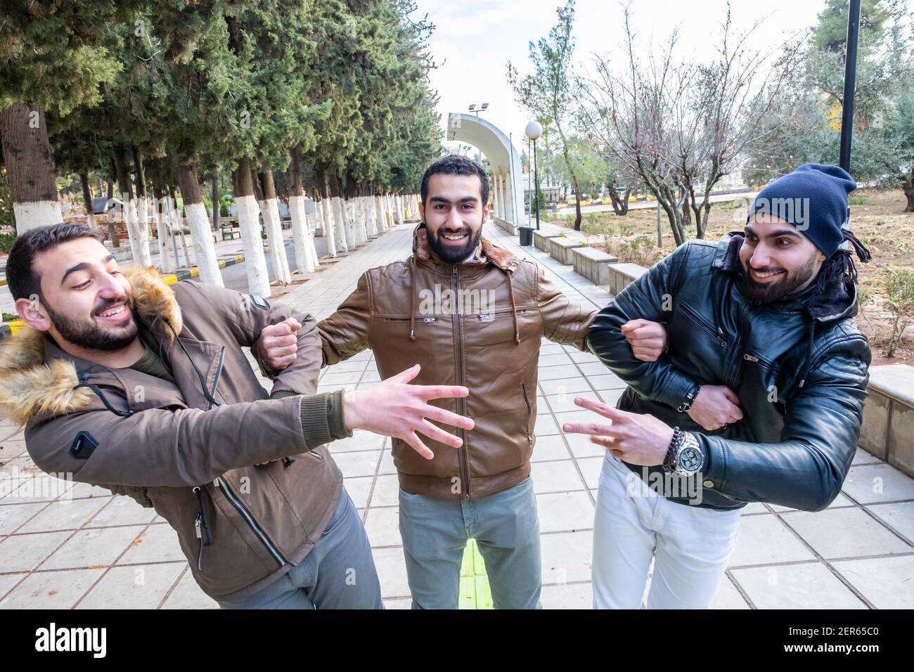 Happy arabic friends enjoying their time at university Stock Photo - Alamy