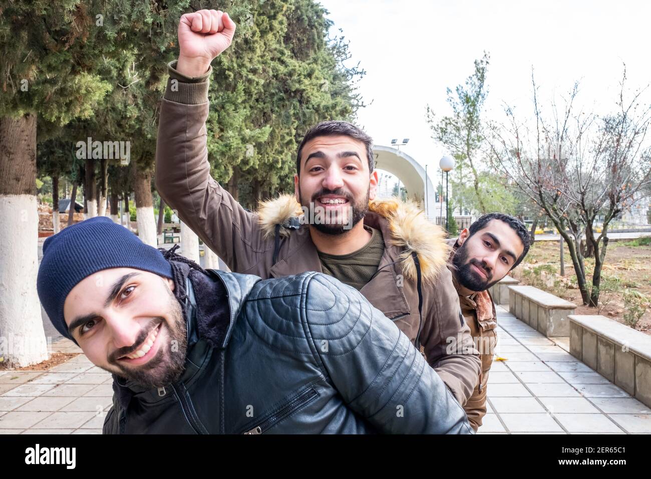 Happy arabic friends enjoying their time at university Stock Photo - Alamy