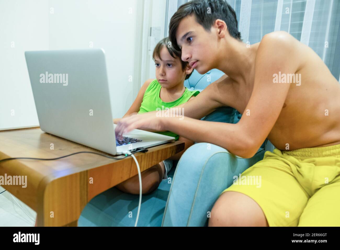 Arabic boy playing on laptop Stock Photo - Alamy