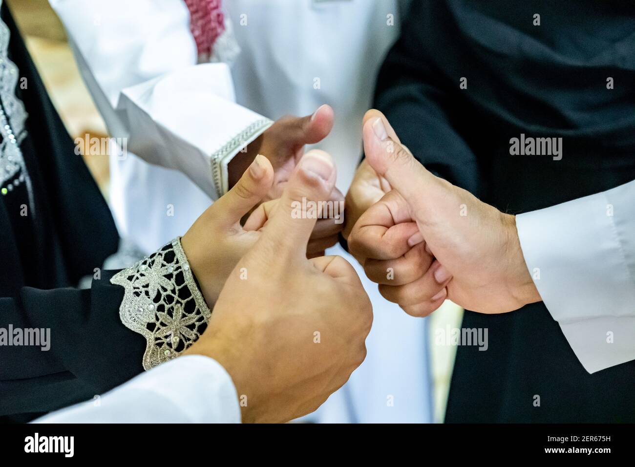 Arabic muslim people hands together forming a symbol Stock Photo - Alamy