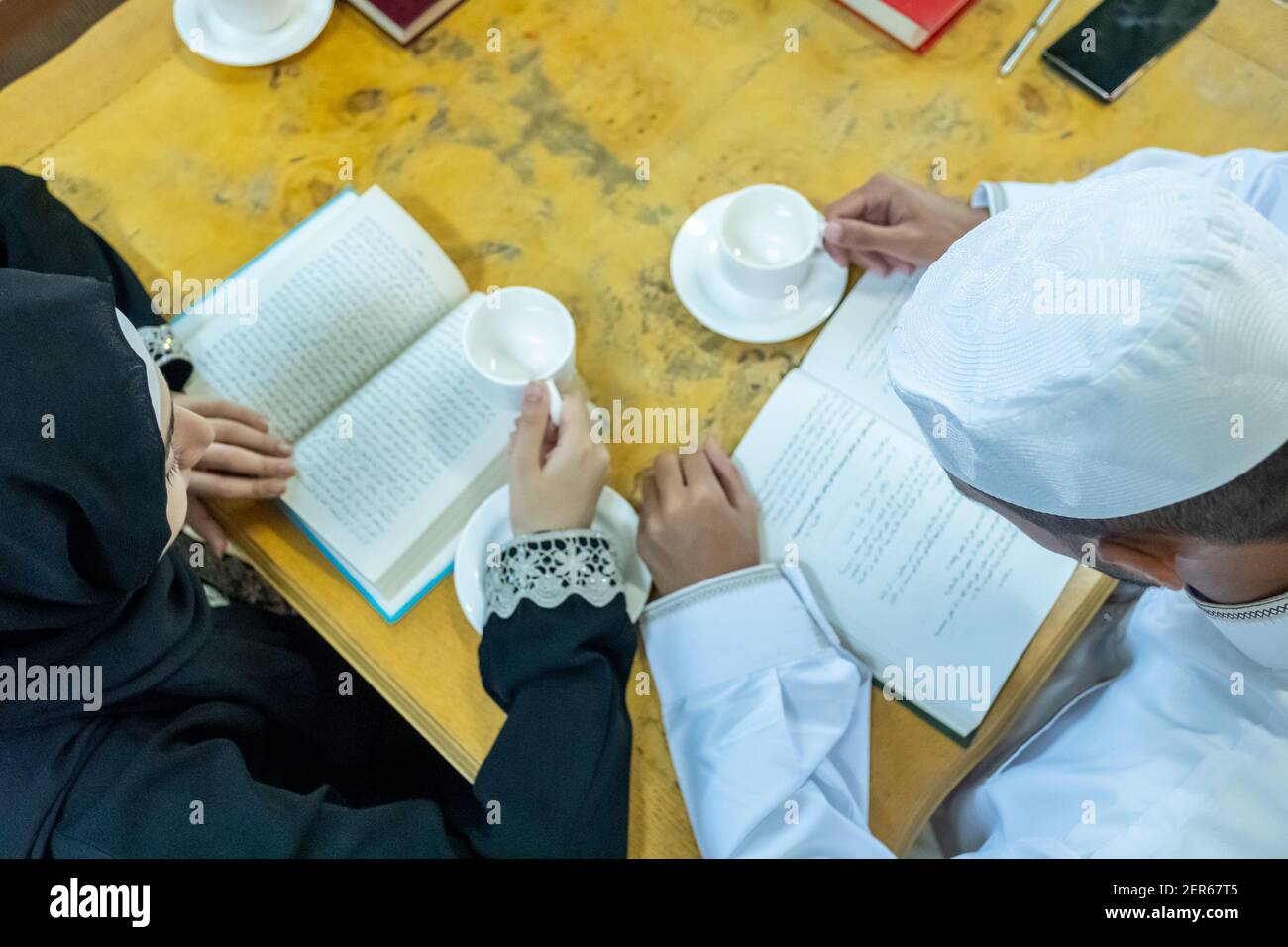 Arabic muslim people reading together and drnking some tea Stock Photo ...