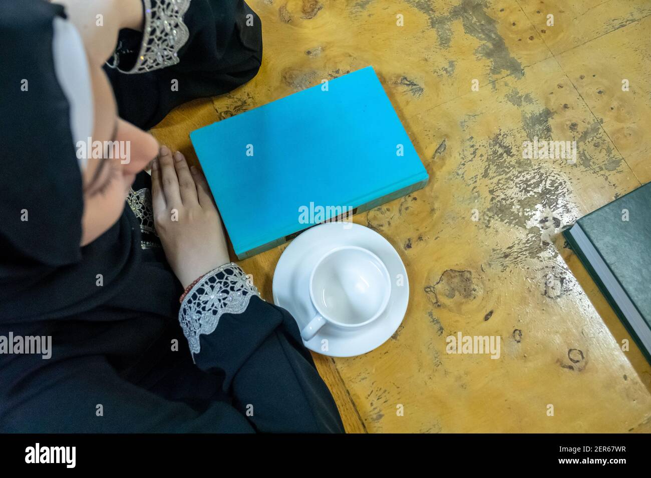Arabic muslim people reading together and drinking some tea Stock Photo ...