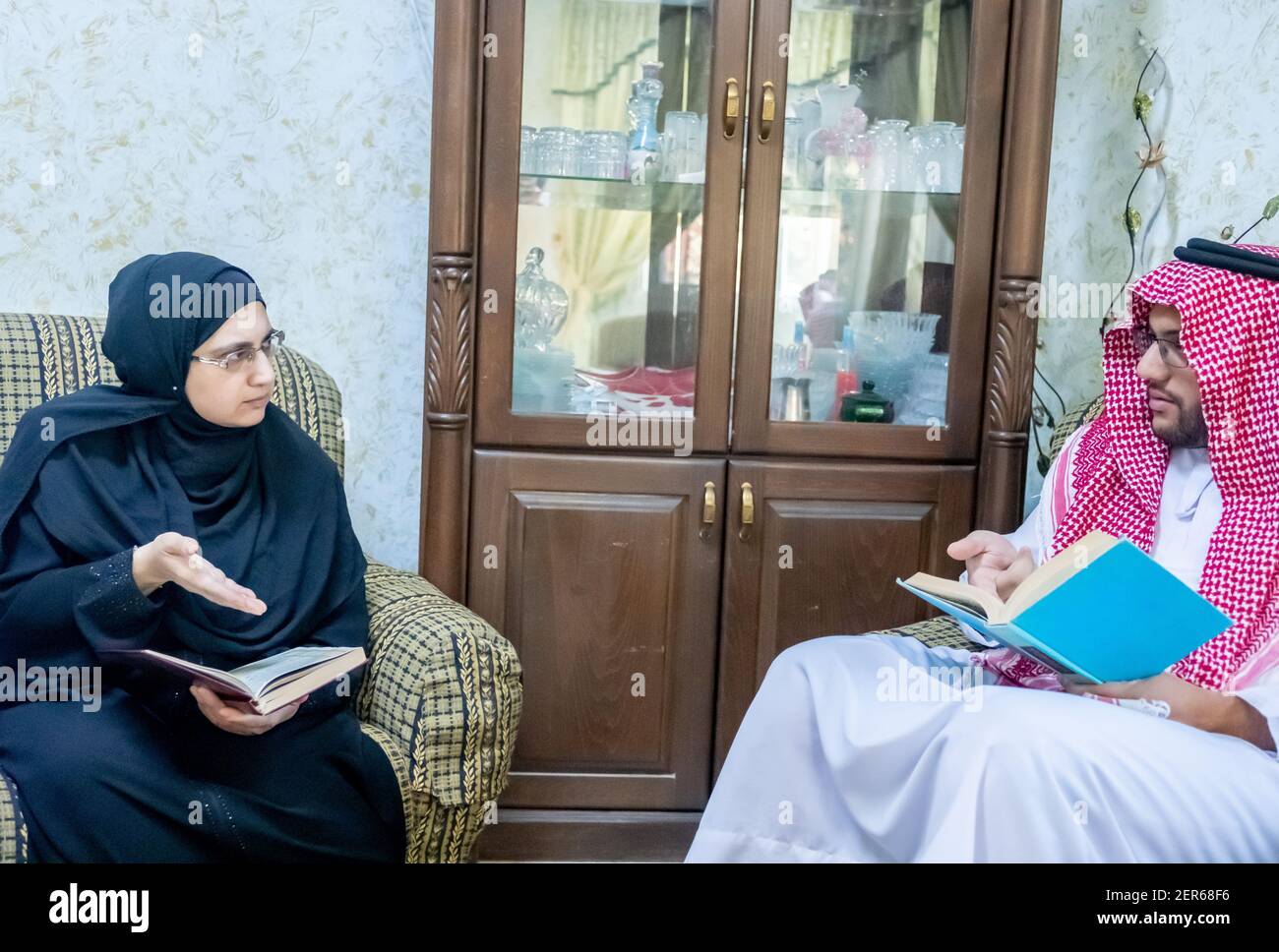 Happy muslim family reading books together and discussing ideas Stock ...