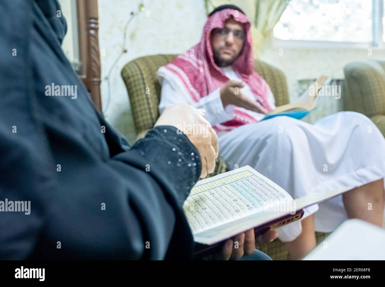 Happy muslim family reading books together and discussing ideas Stock ...