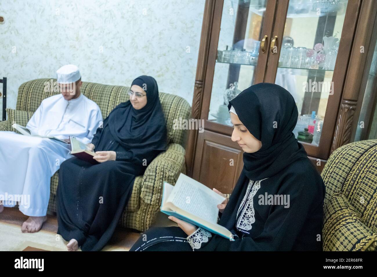 Happy muslim family reading books together and discussing ideas Stock ...