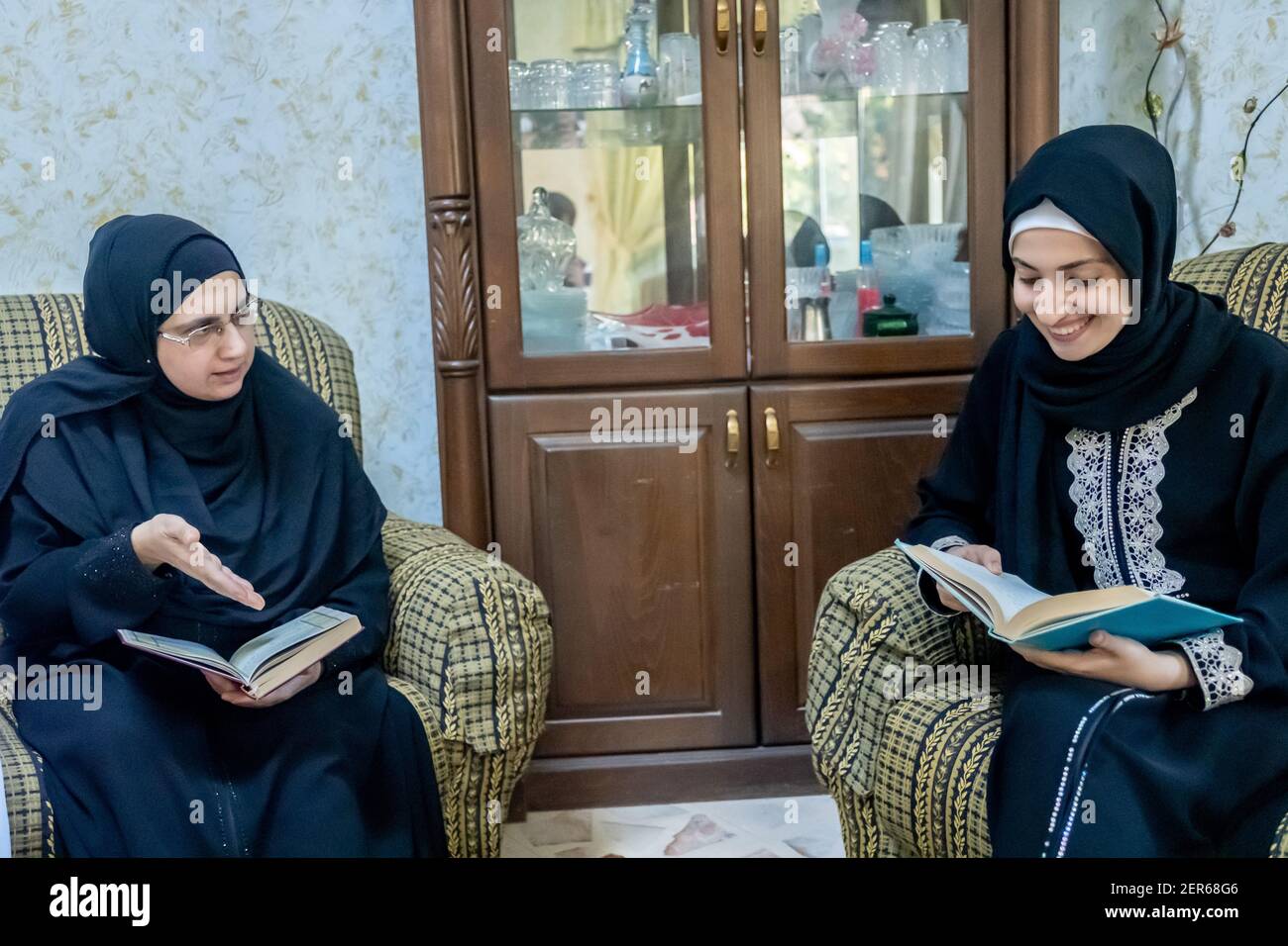 Happy muslim family reading books together and discussing ideas Stock ...