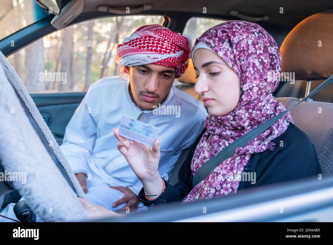Professional muslim woman driving her car Stock Photo - Alamy