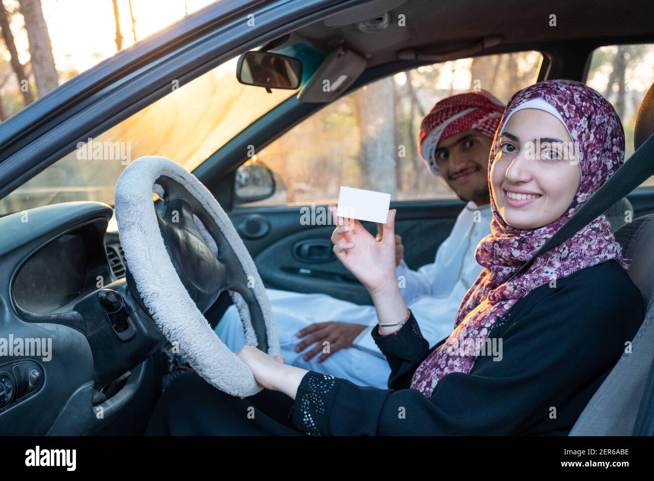 Professional muslim woman driving her car Stock Photo - Alamy