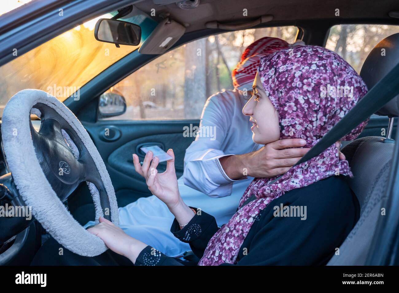 Professional muslim woman driving her car Stock Photo - Alamy