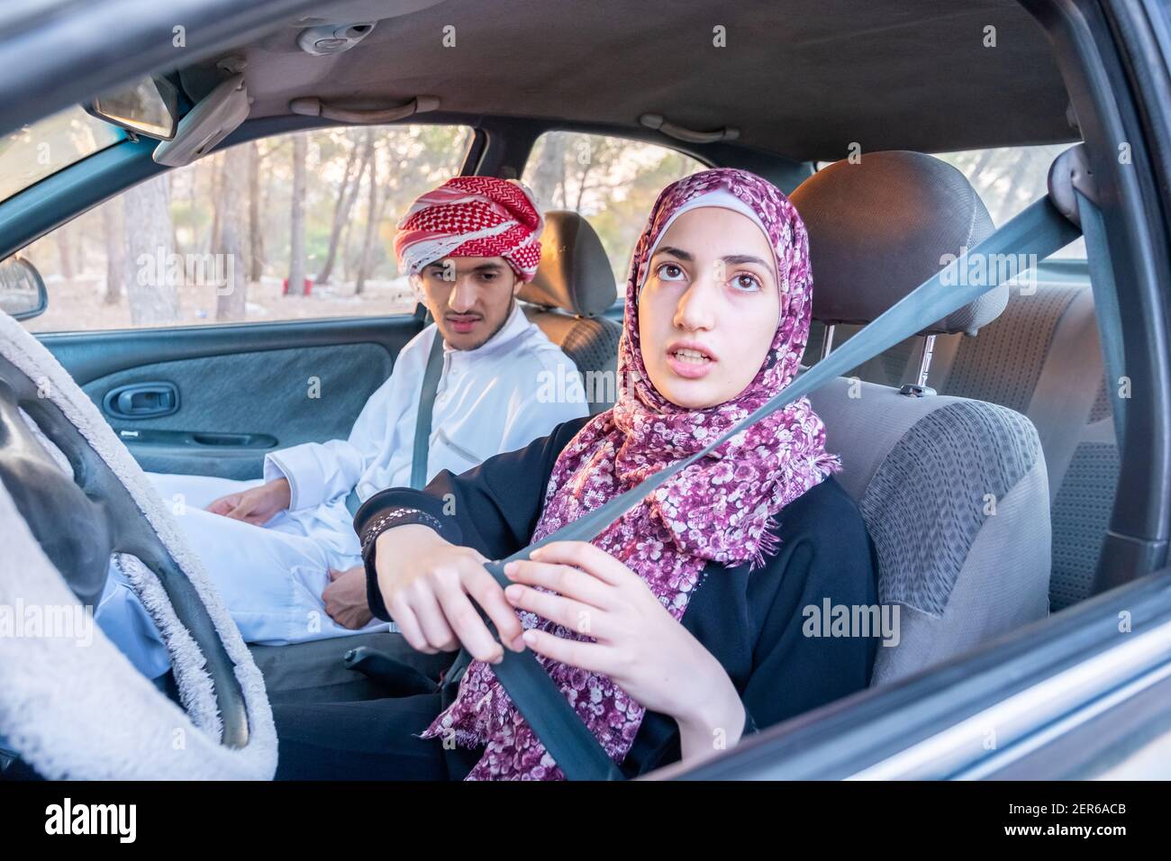 Professional muslim woman driving her car Stock Photo - Alamy