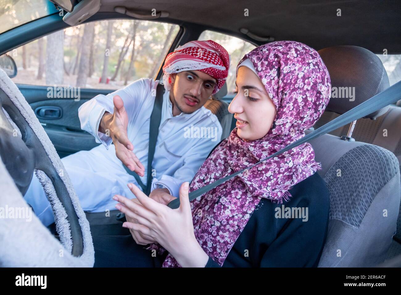 Professional muslim woman driving her car Stock Photo - Alamy