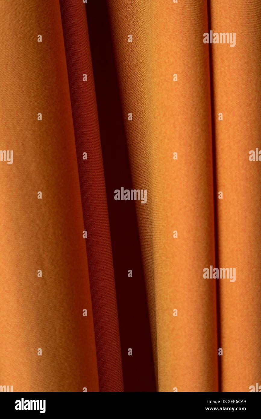 background of pale red fabric with vertical folds Stock Photo - Alamy