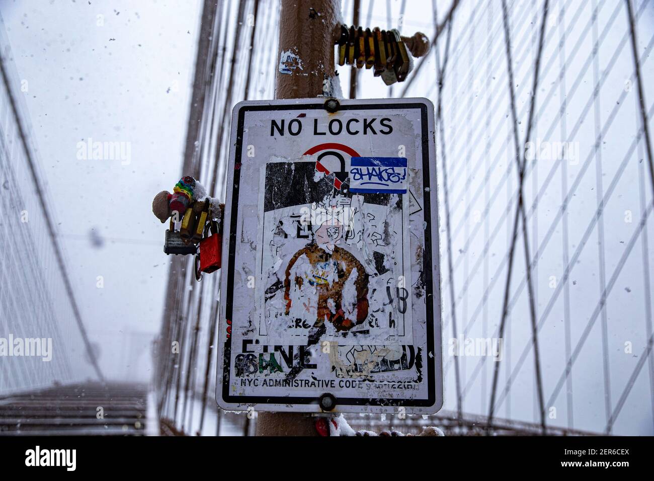 Signs on the Brooklyn Bridge warning placing locks on bridge are seen ...