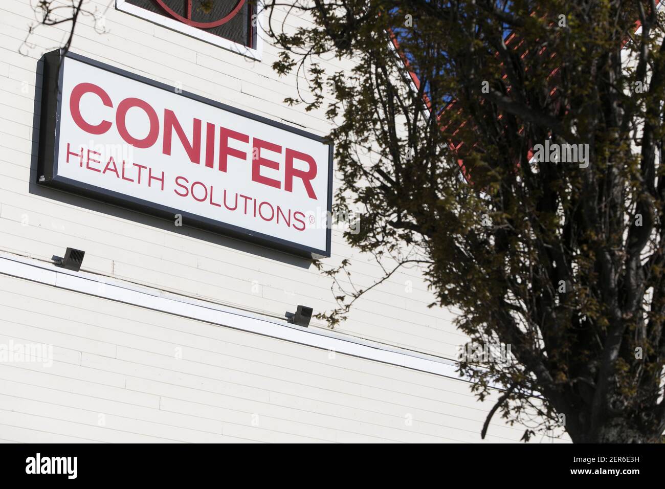 A logo sign outside of a facility occupied by Conifer Health Solutions ...